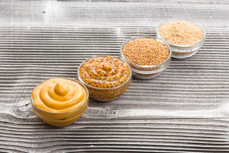 Set of Different Species of Mustard on a Rustic Background Stock Photo ...