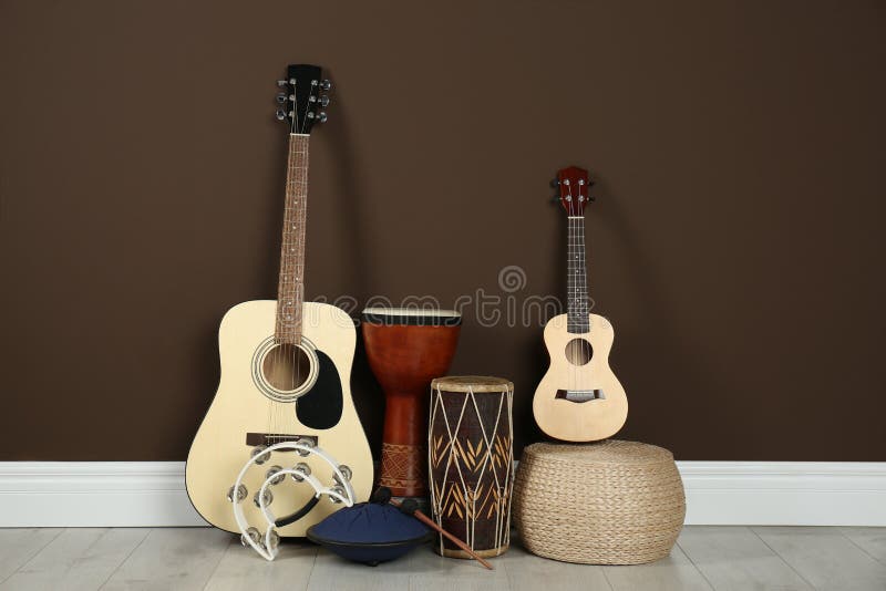 Set of Different String and Percussion Musical Instruments Near Brown ...