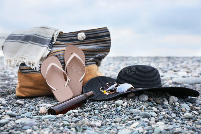 Set of Different Stylish Beach Accessories on Pebble Seashore Stock ...