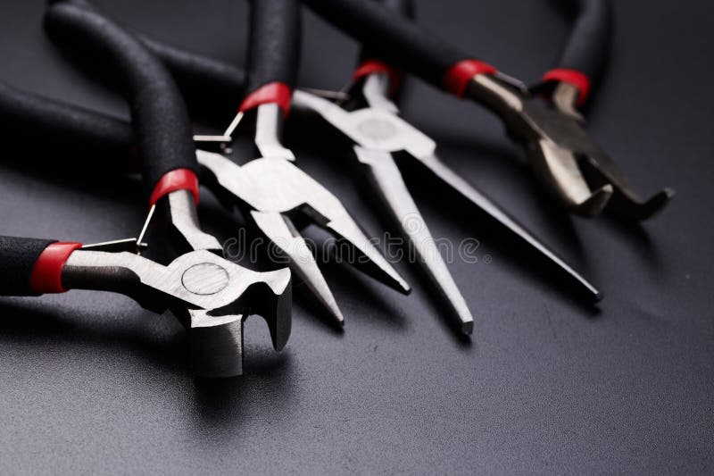 Set of Different Types of Pliers and Side Cutters Isolated on Black ...