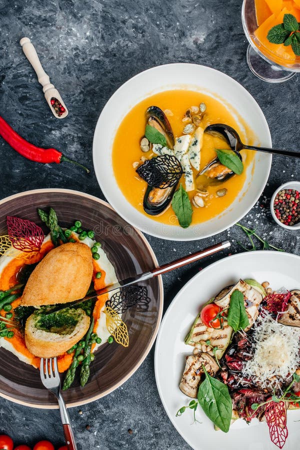 Set of Dishes from Vegetables and Meat on the Table. Food Background ...