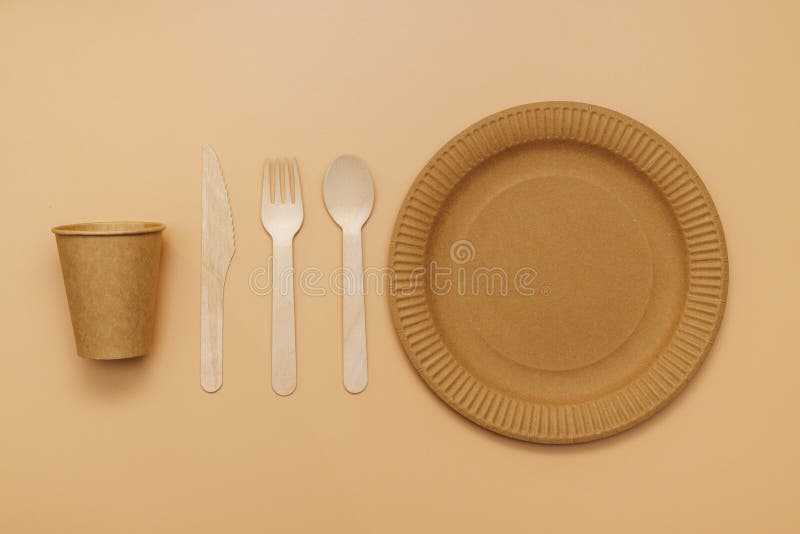 A Set of Disposable Tableware on a Brown Background Stock Image - Image ...