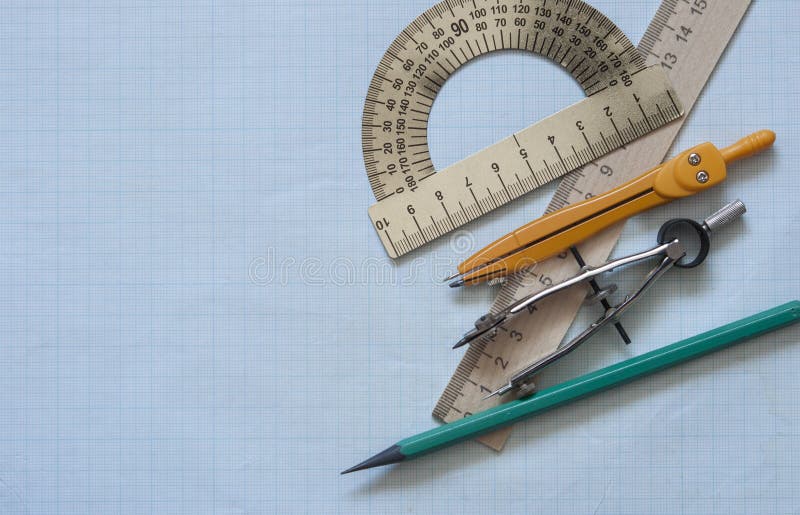 Set of Drawing Instrument and Rulers on Graph Paper Stock Image - Image ...