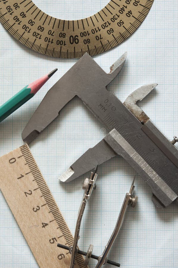 Set of Drawing Instrument and Rulers on Graph Paper Stock Image - Image ...