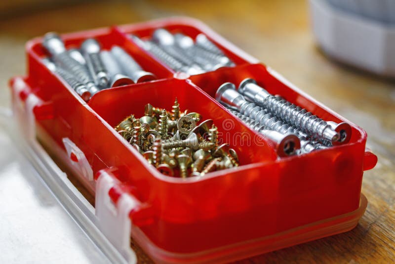 Set of Fasteners for Assembling Furniture in a Red Plastic Storage Box ...
