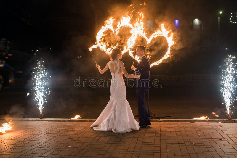 Set fire to the couple stock image. Image of night, energy - 83926701