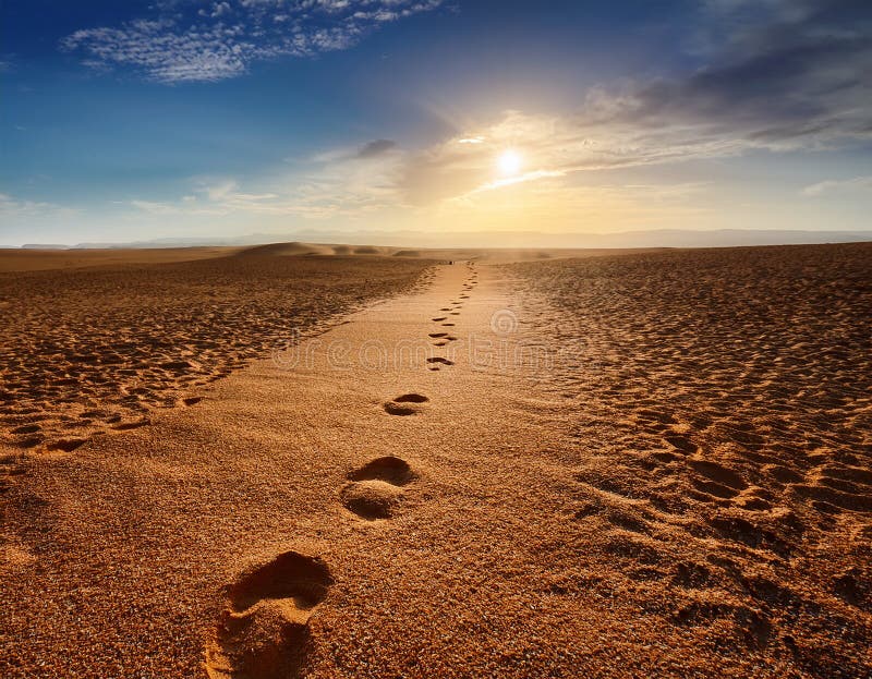 A Set of Footprints Gradually Disappearing on a Dusty Path Leading ...