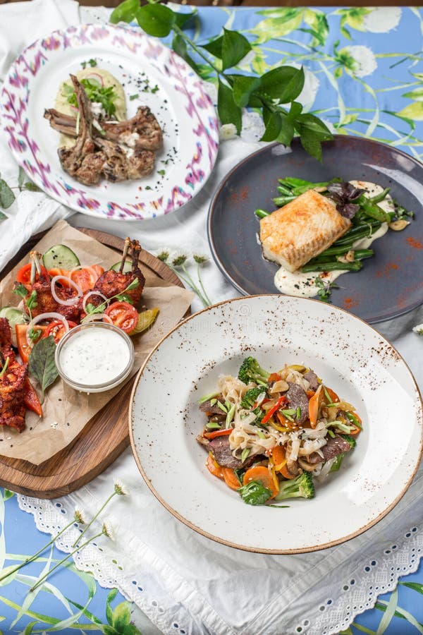 Set of Four Meat and Fish Dishes Business Lunch Combo on the Table at ...