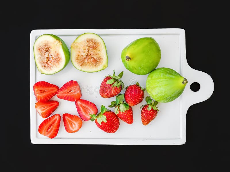 A Set of Fresh Fruit on a White Ceramic Cutting Board Stock Image ...