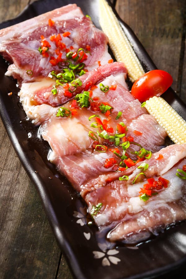 Set of Fresh Pork Chops with Roasted Baby Corn Stock Photo - Image of ...