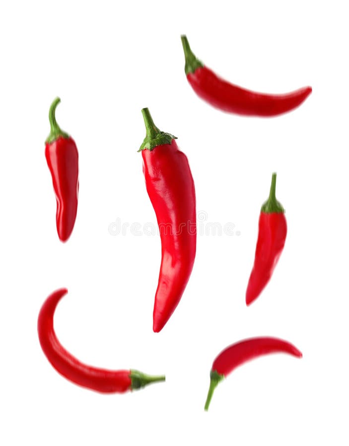 Flying hot red peppers stock image. Image of gourmet - 143503981