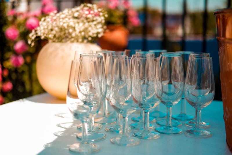 Set of Glasses on the Table in Dim Light Stock Photo - Image of sunset ...