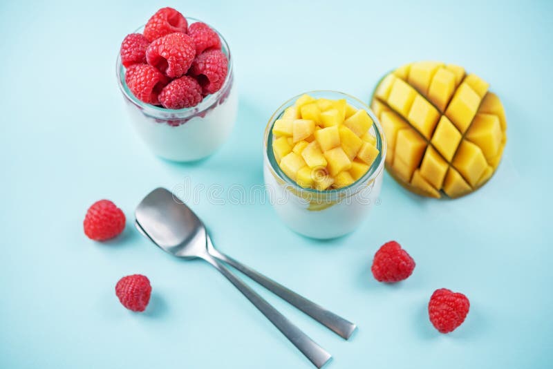 Set of Greek Yogurt Mango and Raspberry Parfait in Jars Stock Photo ...
