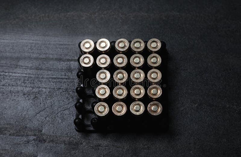 Set of Gun Bullets on Dark Table, Above View Stock Image - Image of ...