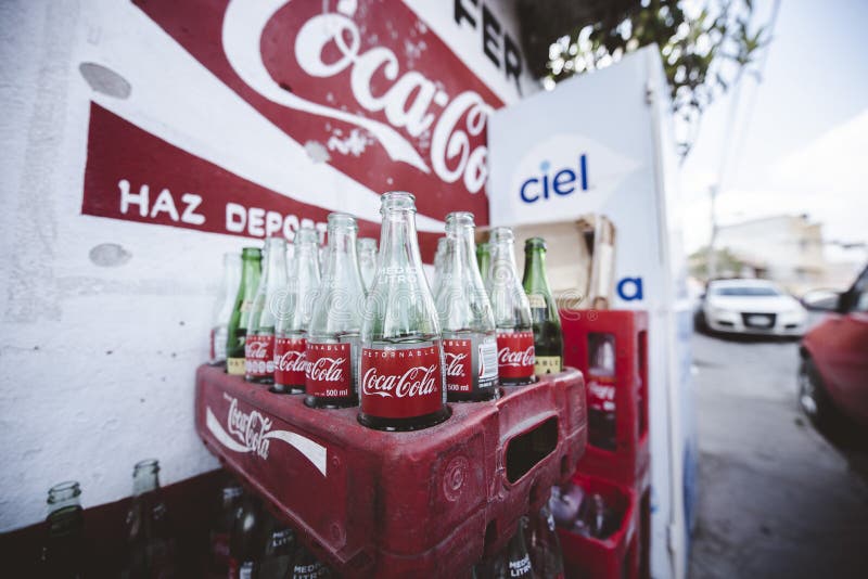 Set of Half-empty Coca-Cola Glass Bottles in a Red Coca-Cola Box ...