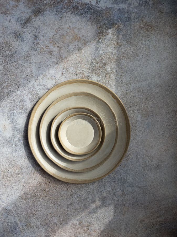 A Set of Handmade Stoneware Ceramic Plates Stock Illustration ...