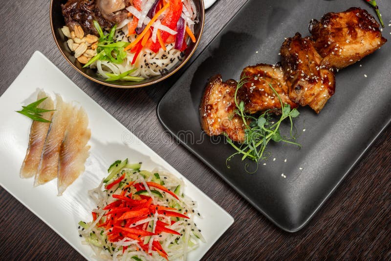 A Set of Japanese Dishes on the Table Stock Image - Image of black ...