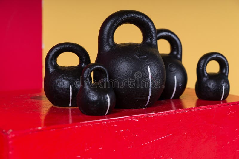 Set of Kettlebell Weights on Red Platform Stock Photo - Image of steel ...