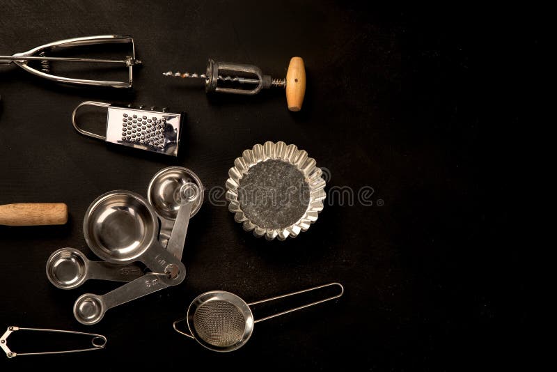 Set of Kitchen Utensils on Black Background. Tools for Cooking Stock ...