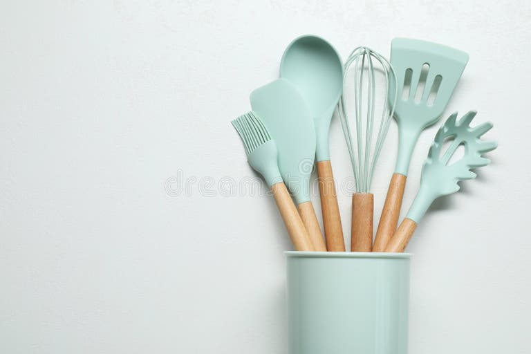 Set of Kitchen Utensils in Holder on White Table, Top View. Space for ...