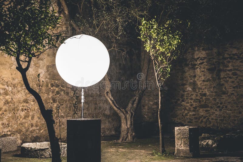 Set of Light with Round Shade Lamp in the Night. View of a Stone Wall ...