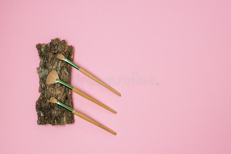 Set of Make Up Brushes on Tree Bark on Pink Background Make Up Concept ...