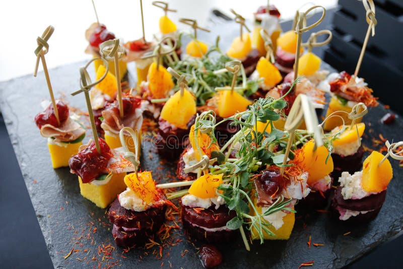 A Set of Mango, Bacon and Greens Appetizers on a Buffet Table Stock ...