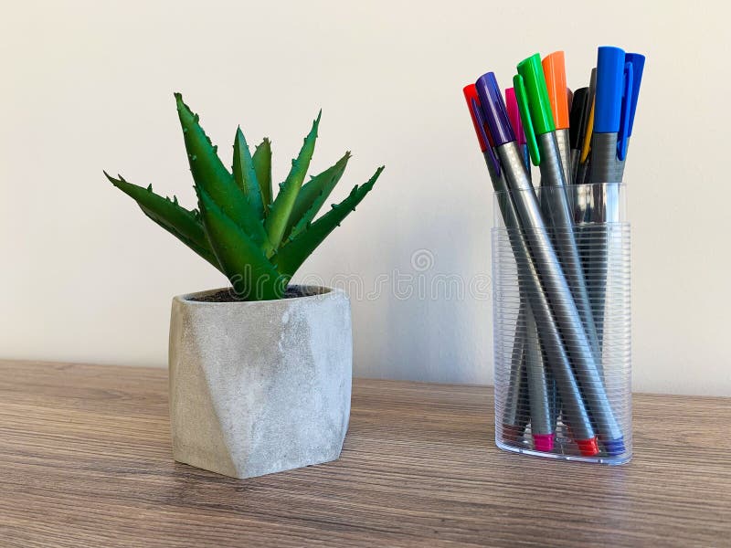 Set of Markers in a Plastic Cup on Wood Table. Stock Photo - Image of ...