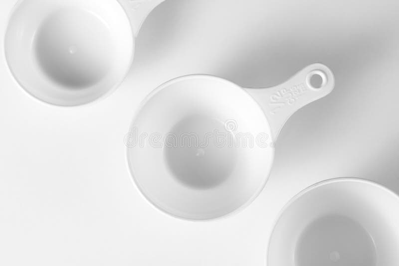 Set of Measuring Cups Lined Up, Top View, White Background Stock Image ...