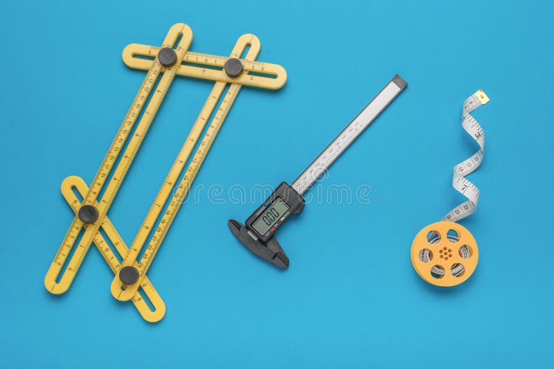 A Set of Measuring Instruments on a Blue Background Stock Photo - Image ...