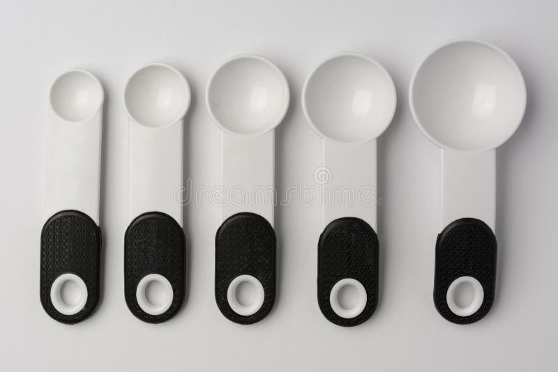 Set of Measuring Spoons Lined on White Background Top View Stock Image ...