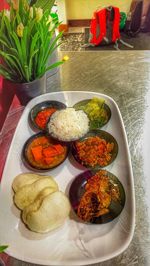 A Set Menu Consists of White Rice, Crackers, Fried Catfish, and ...