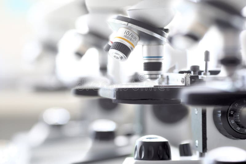 Set of Microscopes Standing in Row in School Chemist Classroom Stock ...