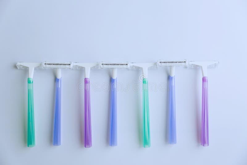 Set of Multi-colored Disposable Razors on a White Background View from ...