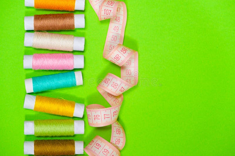 A Set of Multi-colored Threads for Sewing and a Measuring Tape with a ...