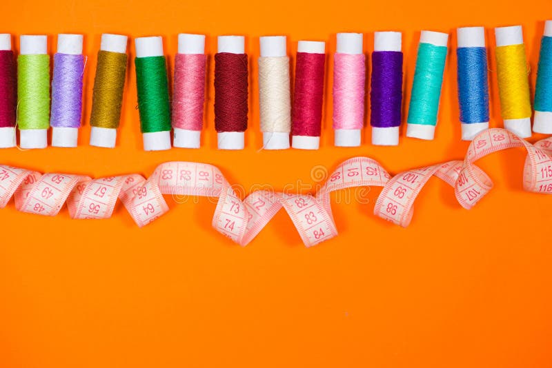 A Set of Multi-colored Threads for Sewing and a Measuring Tape with a ...