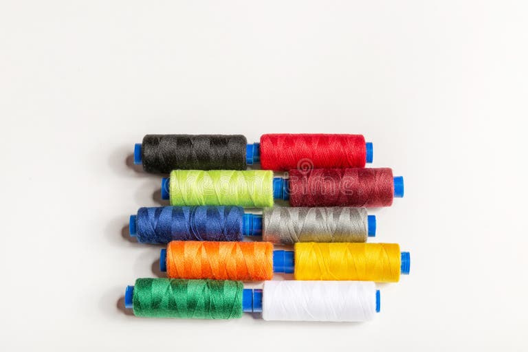Set of Multi-colored Threads for Sewing on a White Background Stock ...