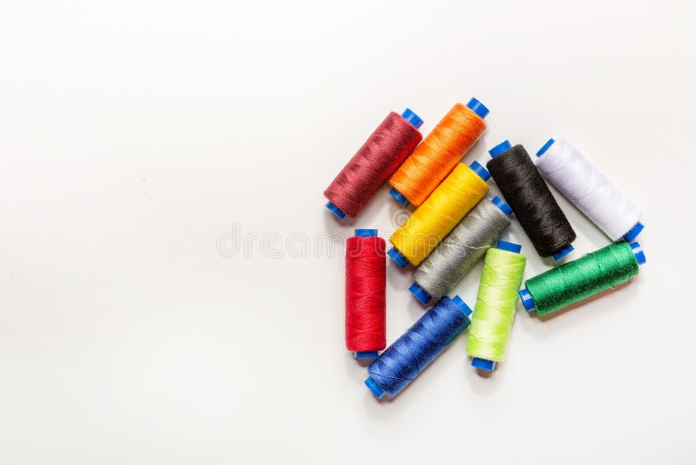 Set of Multi-colored Threads for Sewing on a White Background Stock ...