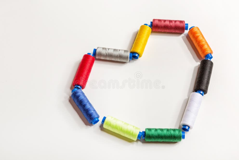 Set of Multi-colored Threads for Sewing on a White Background Stock ...