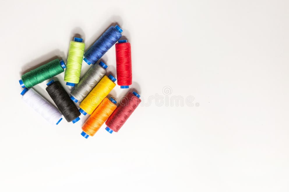 Set of Multi-colored Threads for Sewing on a White Background Stock ...