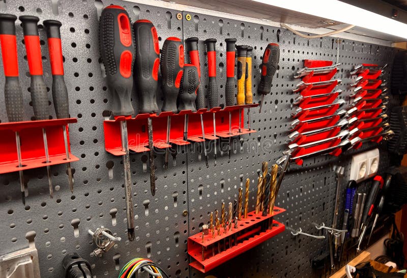 Set of Organized Different Tools Hanging on a Wall in a Garage Stock ...