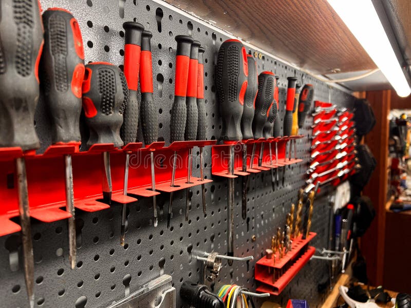 Set of Organized Different Tools Hanging on a Wall in a Garage Stock ...