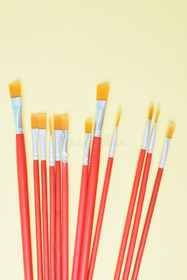 Set of Paint Brushes on Yellow Background Stock Image - Image of line ...