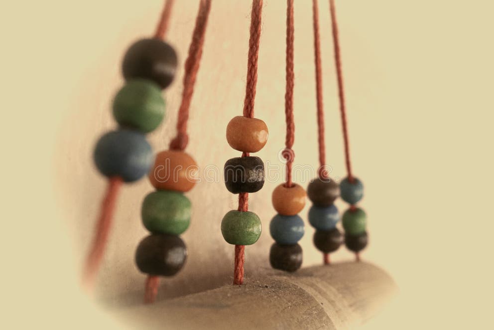 Set of Pebbles Hanged To a Thread with a Small Stick Stock Photo ...