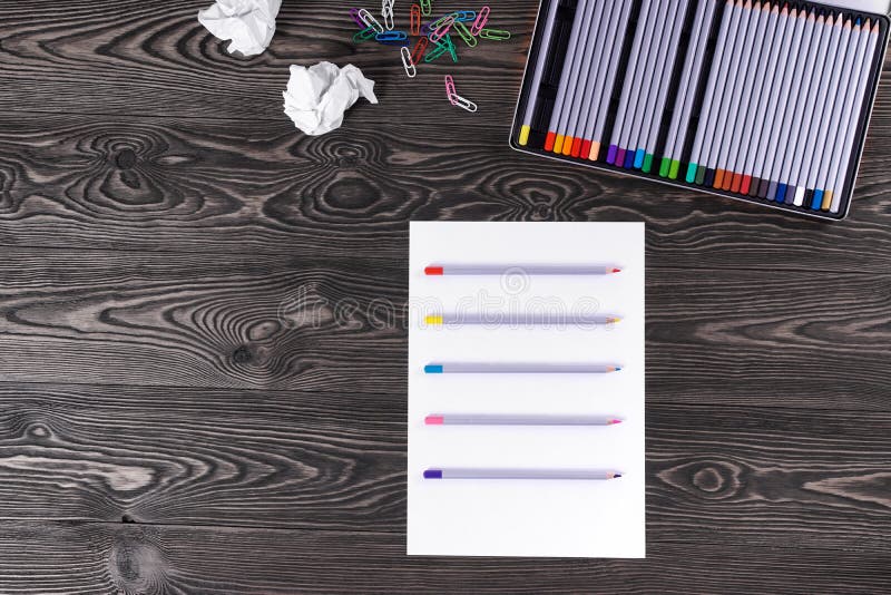 Set of Pencils on Old Boards. Crayons on a Sheet of Paper Stock Image ...