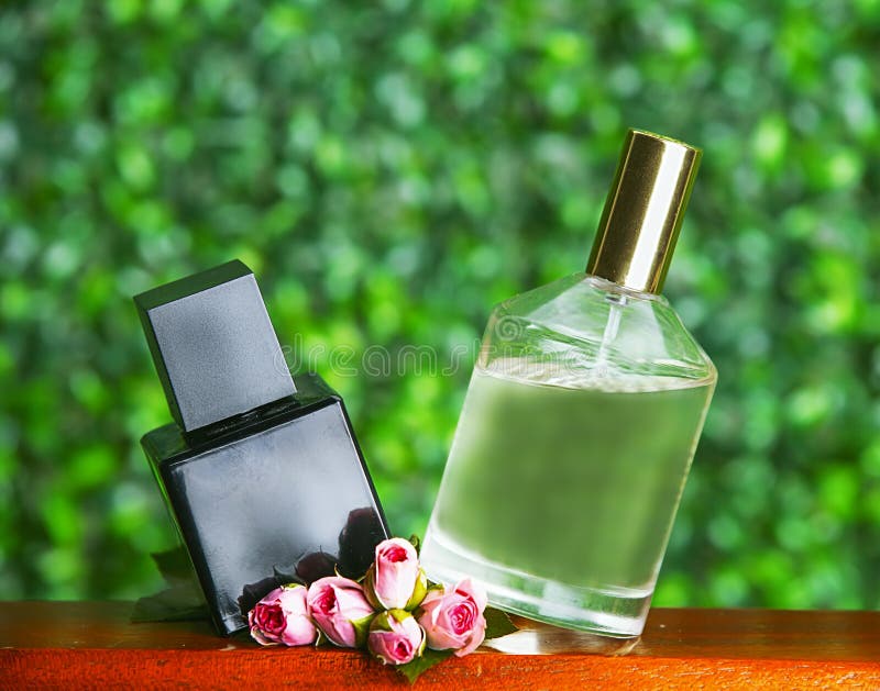 Set of perfume on green stock image. Image of aroma, aromatic - 55693249