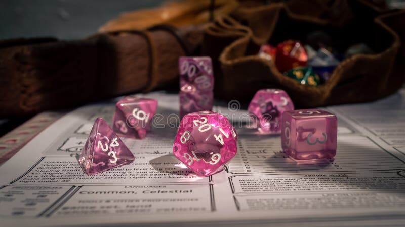Set of Pink RPG Dice on a Character Sheet in the Sun Stock Photo ...