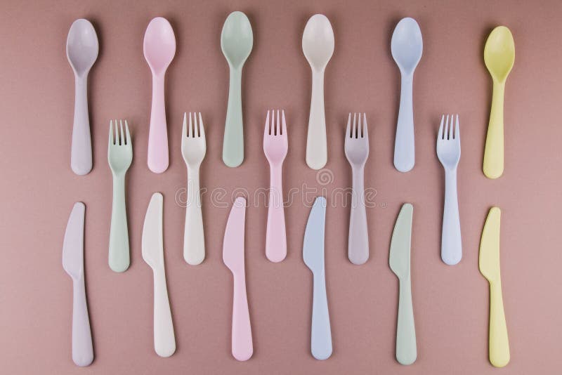 Set of Plastic Cutlery in Different Colors Spoons Forks Knives on the ...