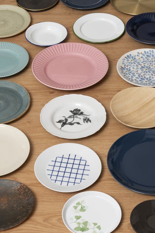 Set of Plates of Different Materials, Styles and Colors Stock Photo ...