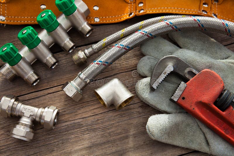 Set of Plumbing and Tools on the Wooden Table Stock Photo - Image of ...